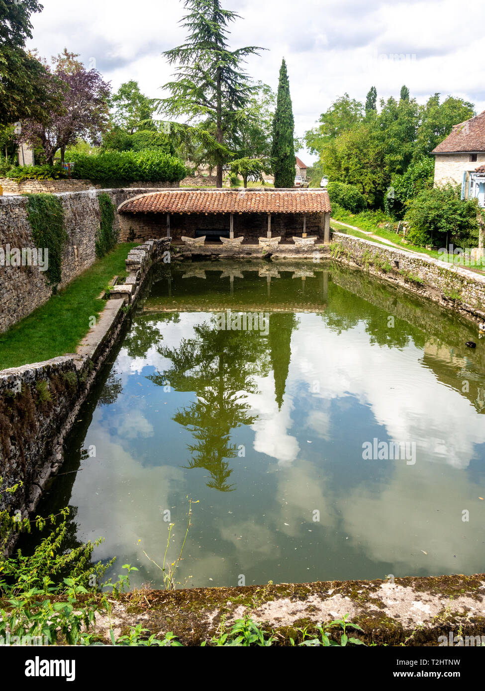 outdoor medieval washing basin in historical village in the Southwest ...
