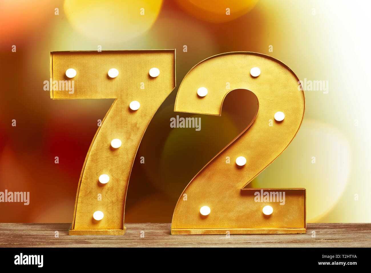 Big plastic numbers with shining light bulbs Stock Photo - Alamy