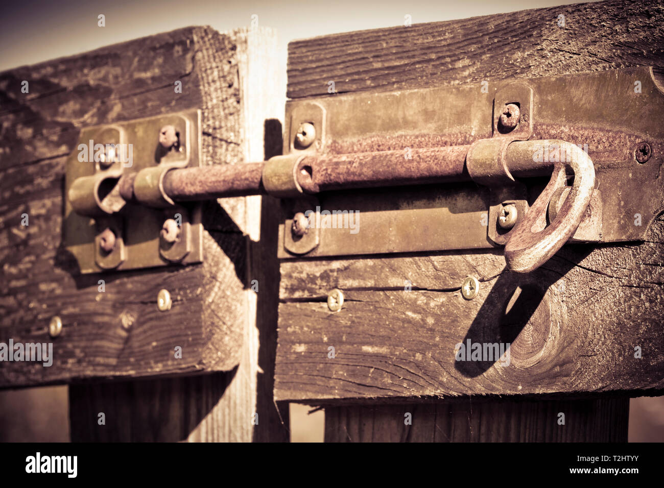 Closed wooden gate with bolt - concept image - toned image Stock Photo ...