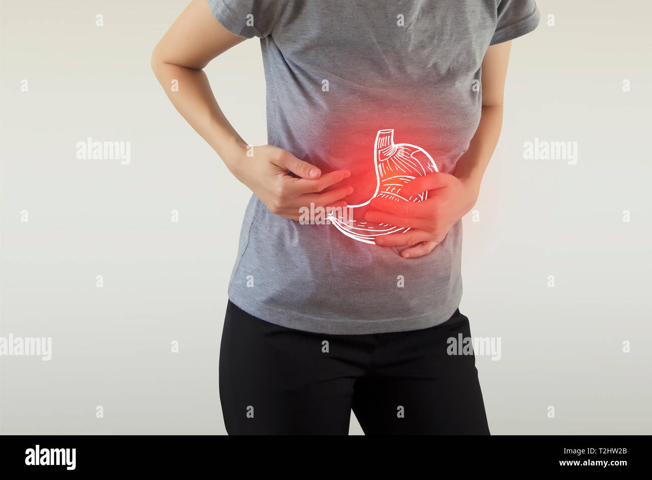Digital composite of highlighted red pain stomach of woman Stock Photo ...