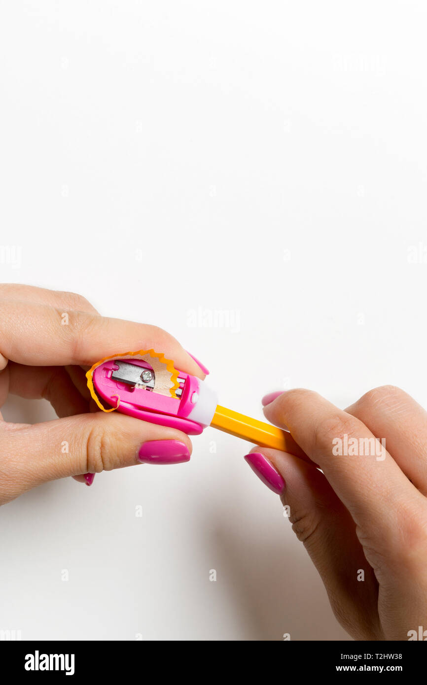 Woman is sharpening the pencil Stock Photo - Alamy