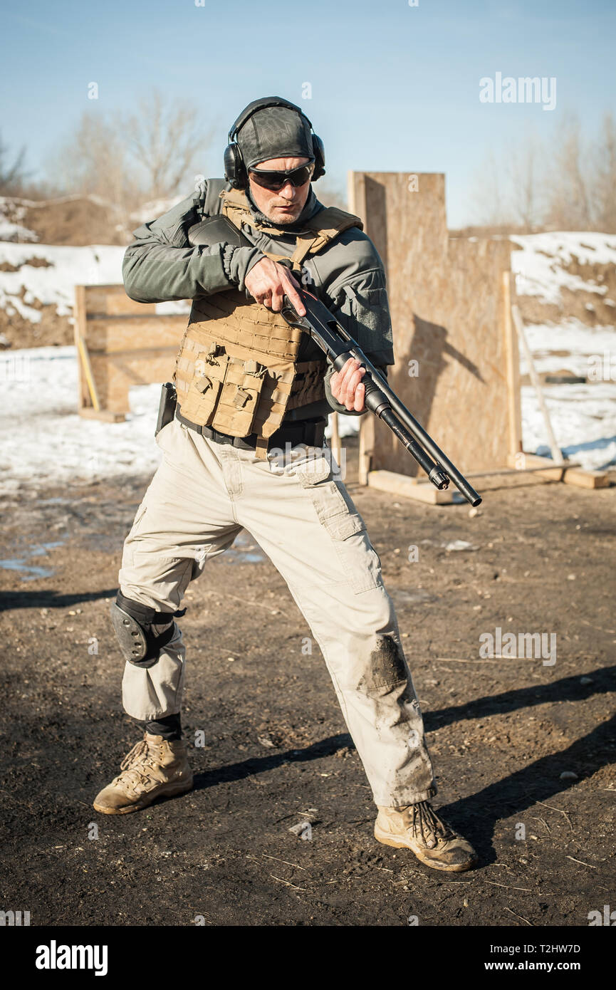 Tactical combat pump gun shooting training. Shotgun weapon action ...