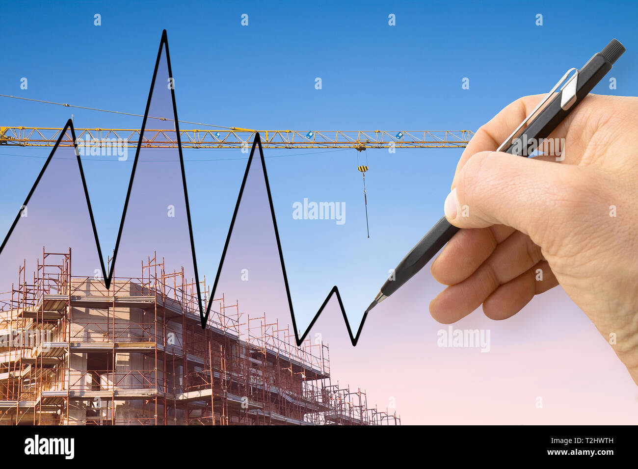 Hand draws a graph with a background of a construction site - concept ...