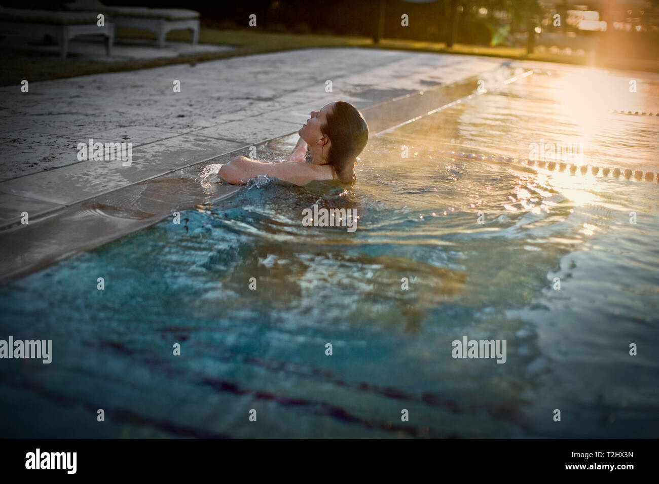 Woman swimming in a pool Stock Photo - Alamy