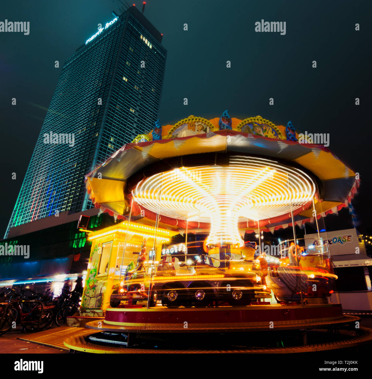 illuminated carousel in motion by night Stock Photo - Alamy