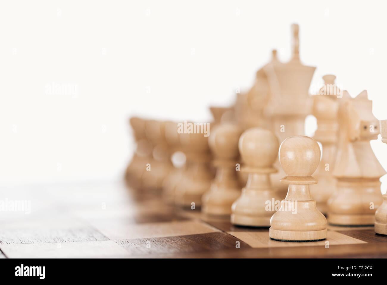 selective focus of beige and brown wooden chessboard with chess figures ...