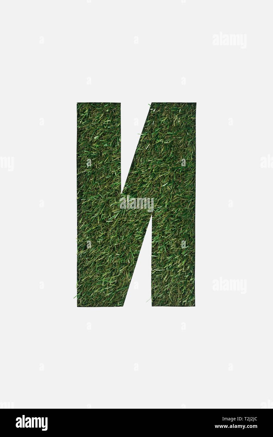 cut out cyrillic letter with fresh grass on background isolated on ...