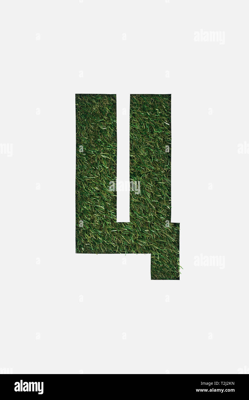 top view of cyrillic letter with green grass on background isolated on ...