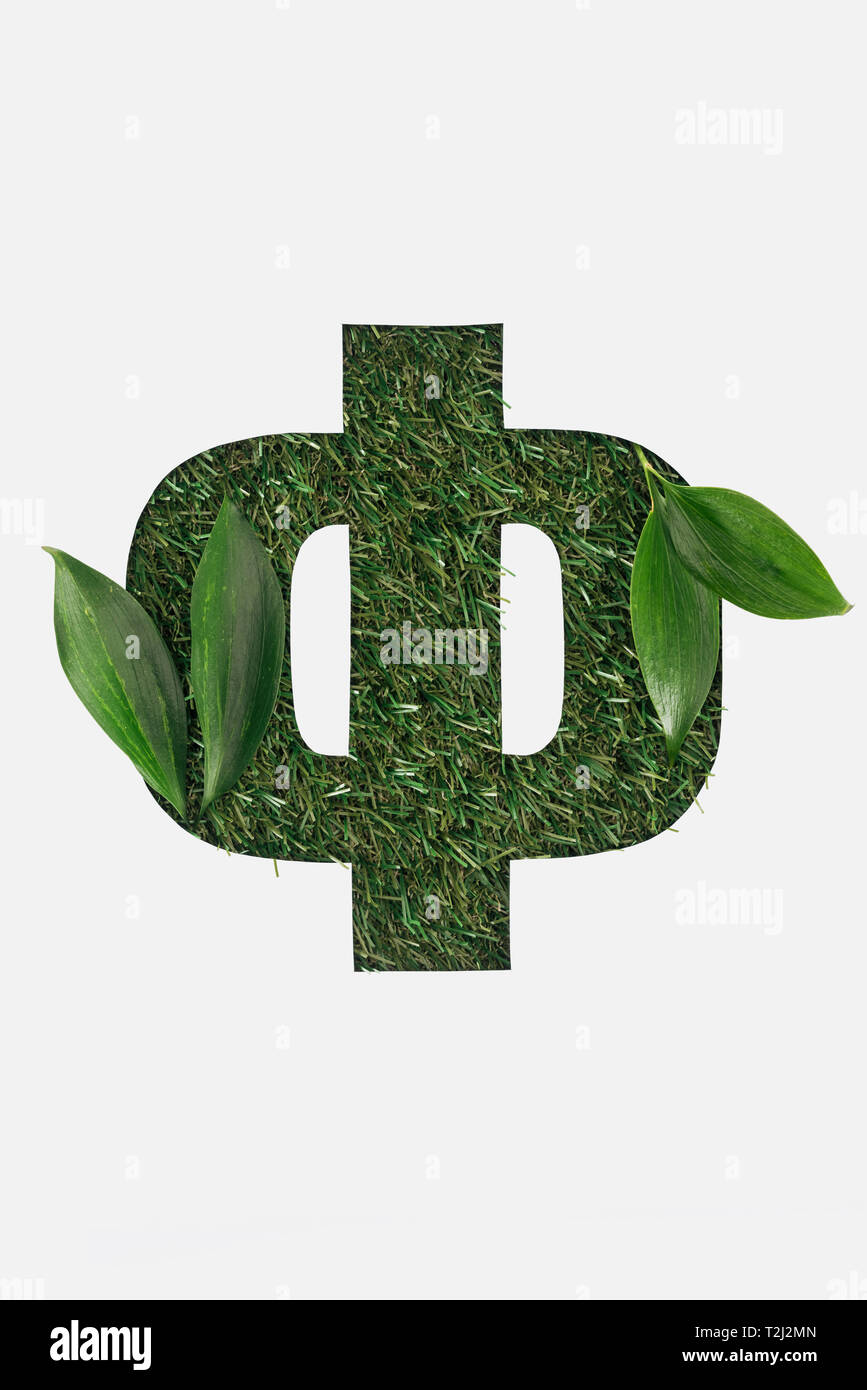 top view of cyrillic letter with green grass on background and bright ...