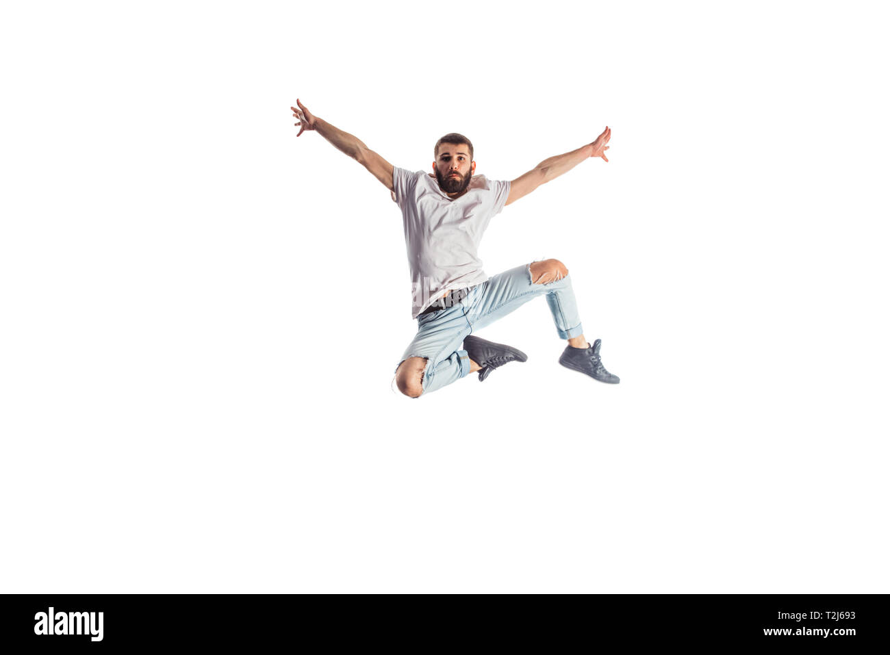 Dancer jumping on white background Stock Photo - Alamy