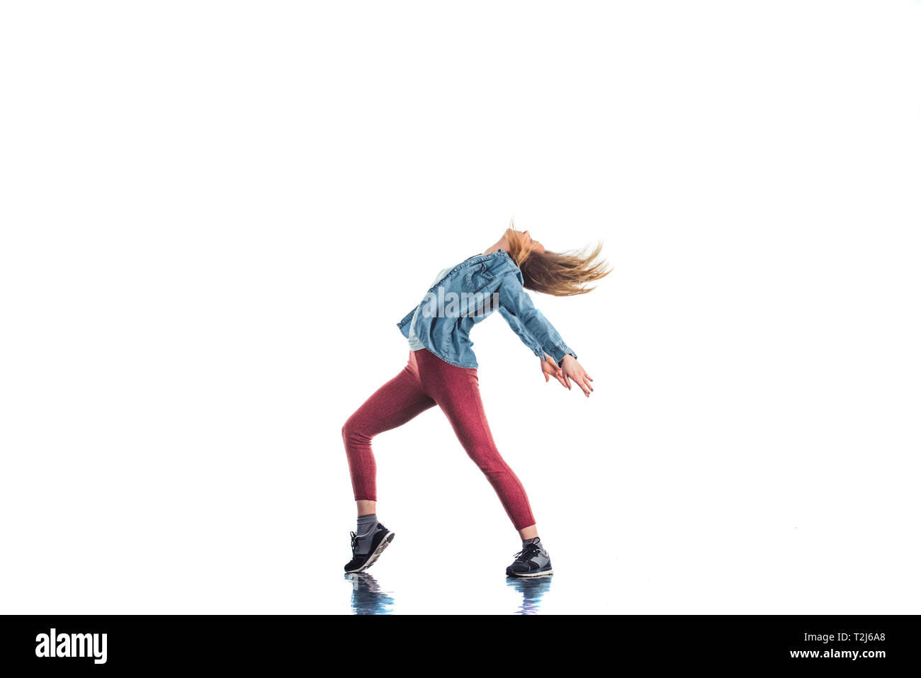 Fit girl doing amazing aerobic exercise isolated on white background ...