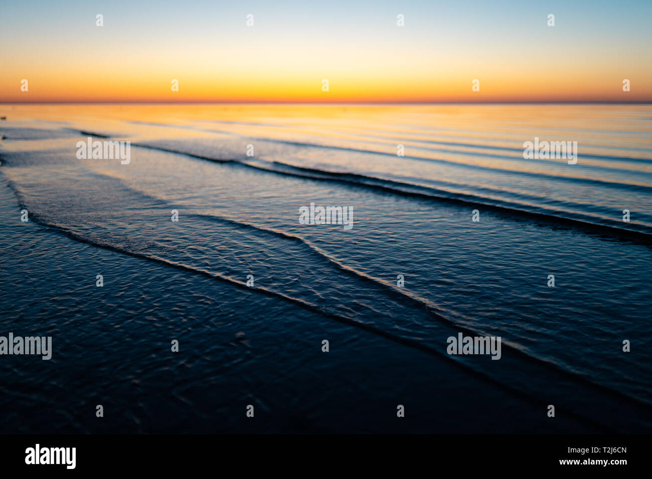 Vivid amazing sunset in Baltic States - Dusk in the sea with horizon ...