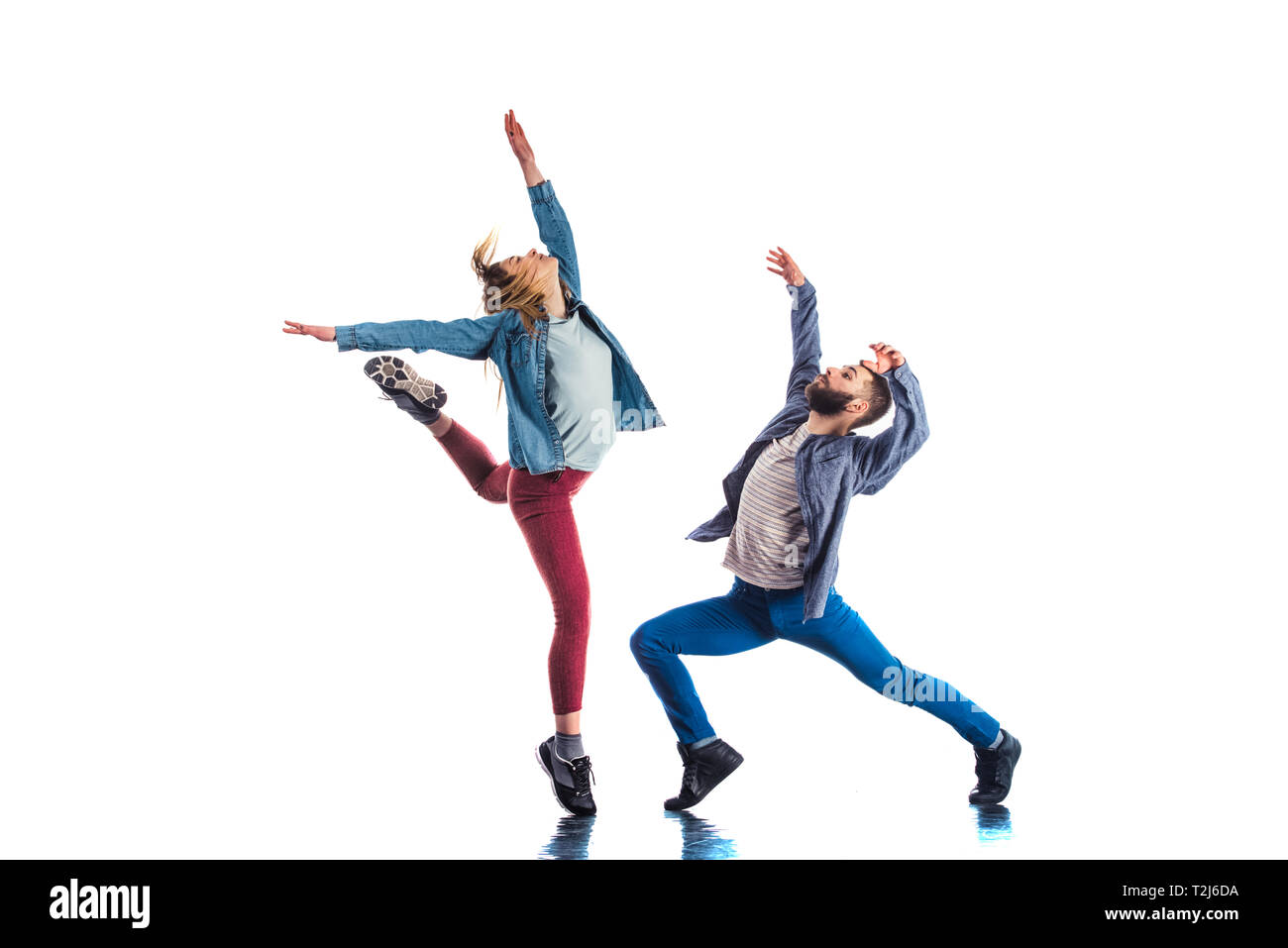 Two people are having fun while dancing on white background Stock Photo ...