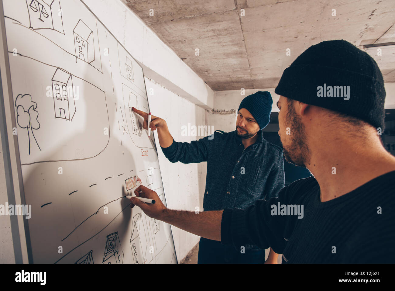Two robbery men simulate bank robbery on map Stock Photo - Alamy
