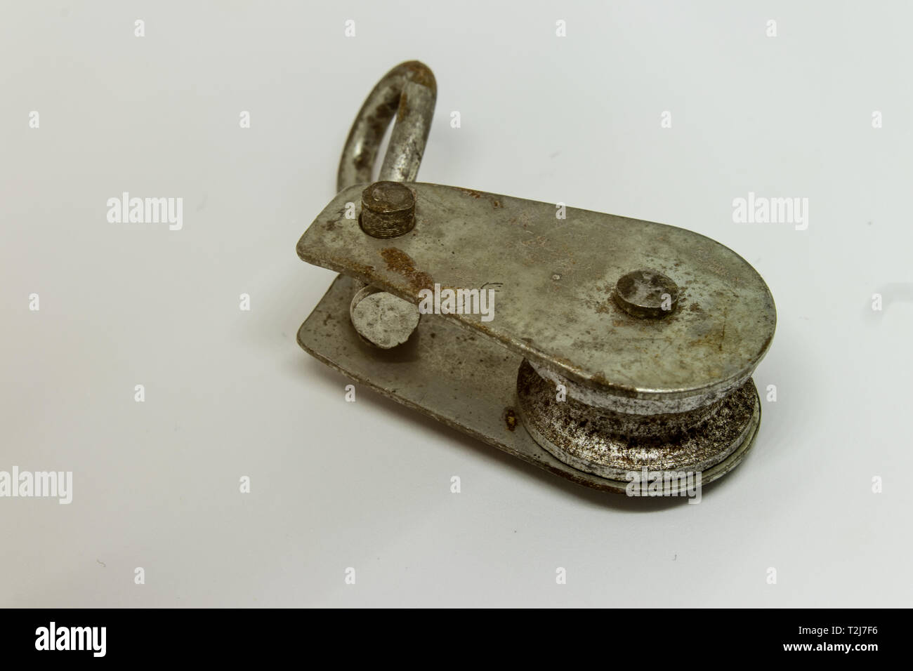 an old rusty connection tool closeup. product shoot with white ...