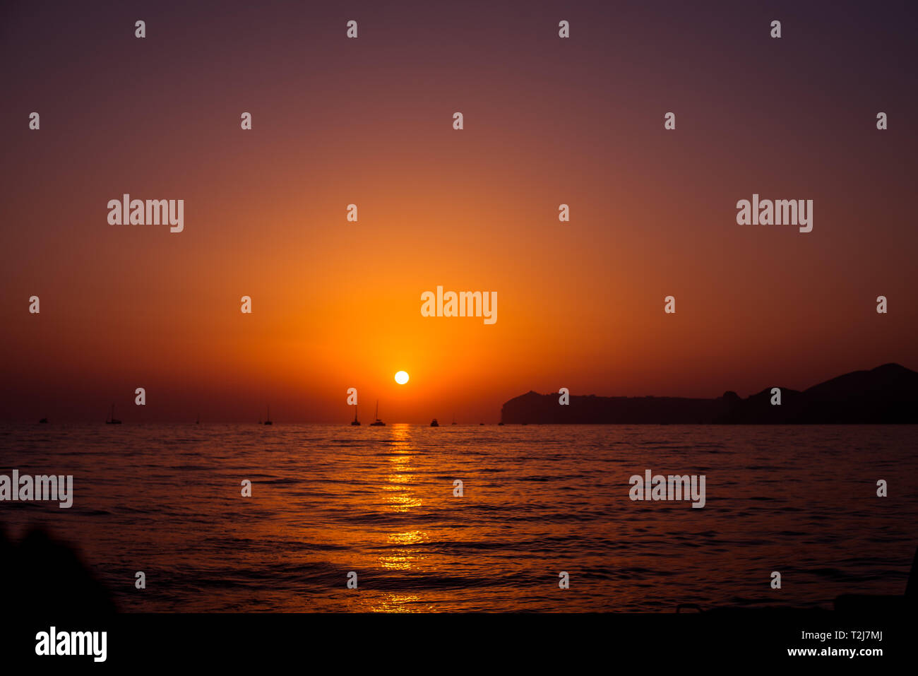 Boats cruising the Aegean Sea watch one of the most beautiful sunsets ...