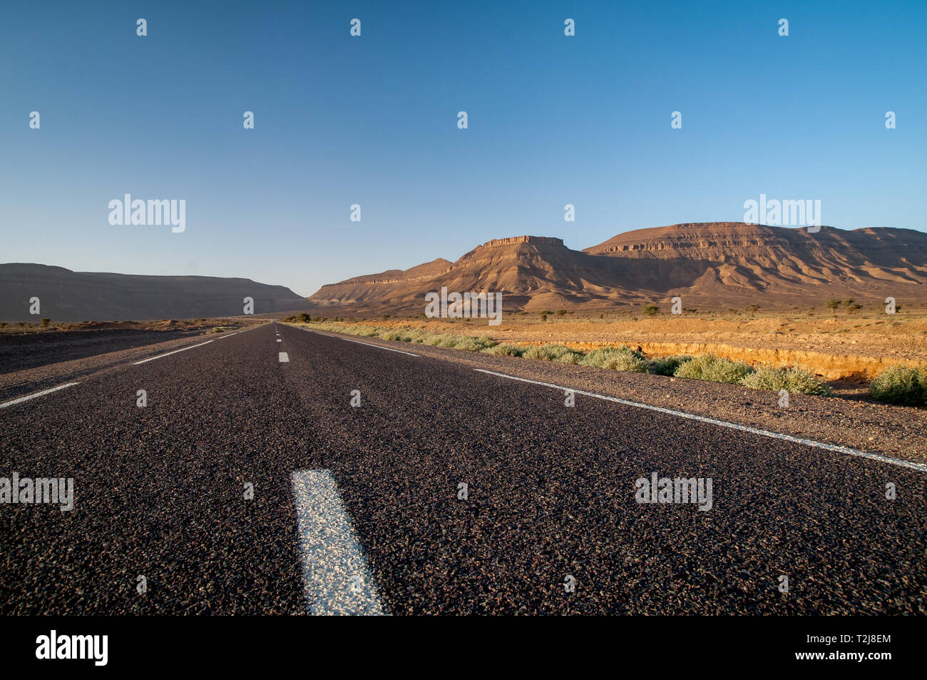 Straight highway in beautiful moroccan landscape with mountains in the ...