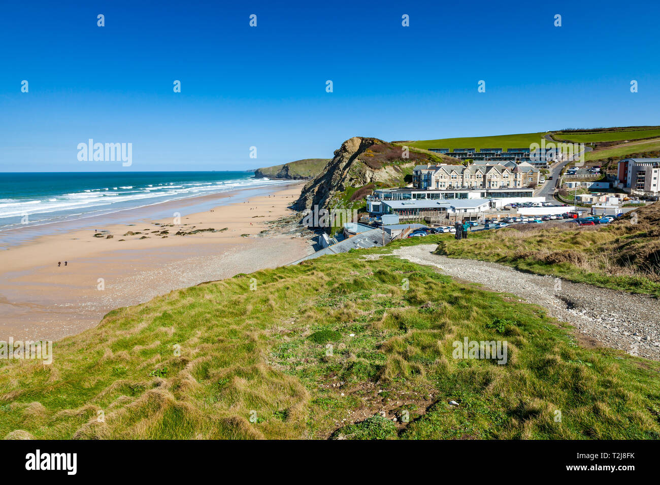 On the coast path overlooking the golden sandy beach at Watergate Bay ...