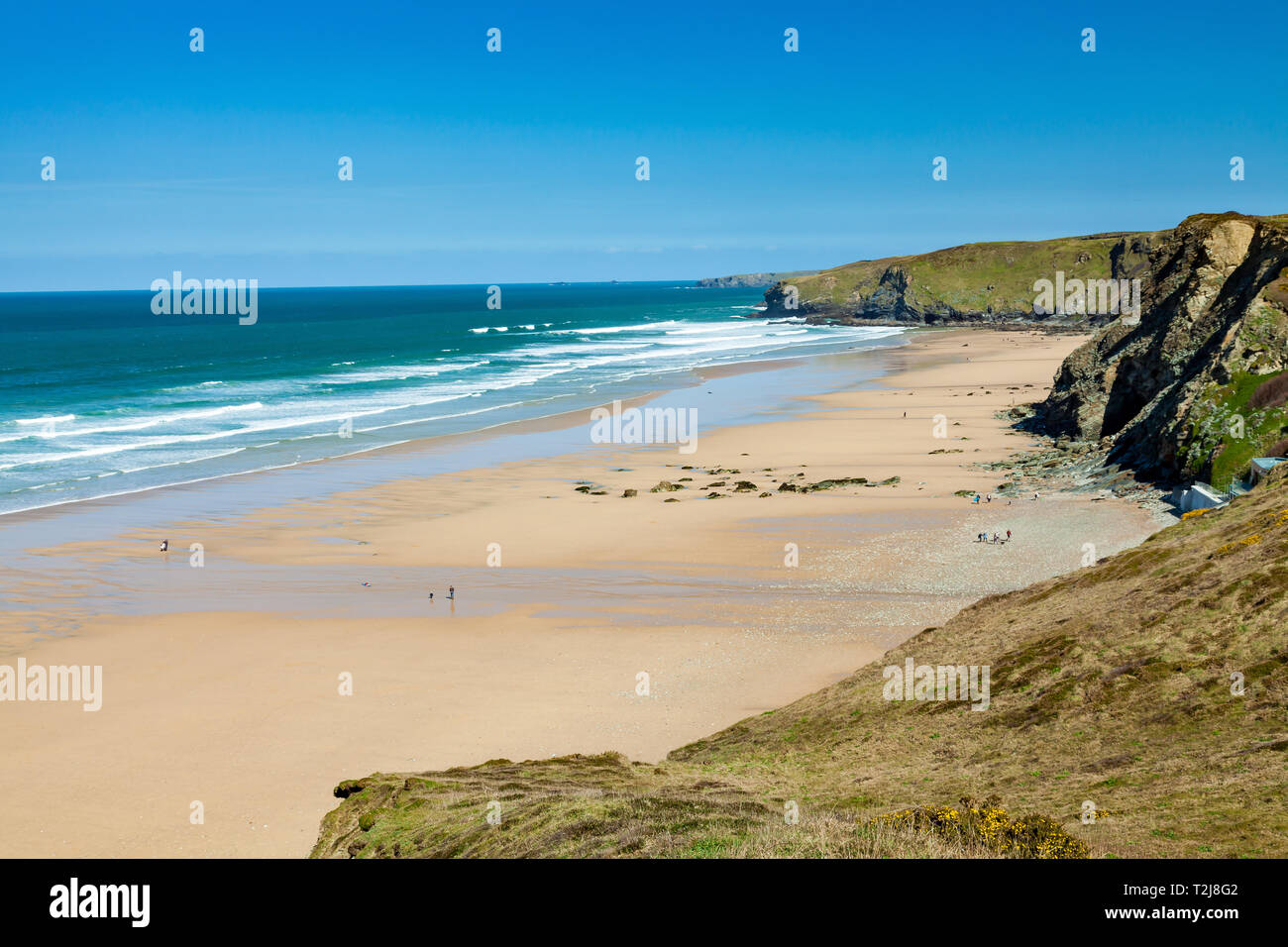 On the coast path overlooking the golden sandy beach at Watergate Bay ...
