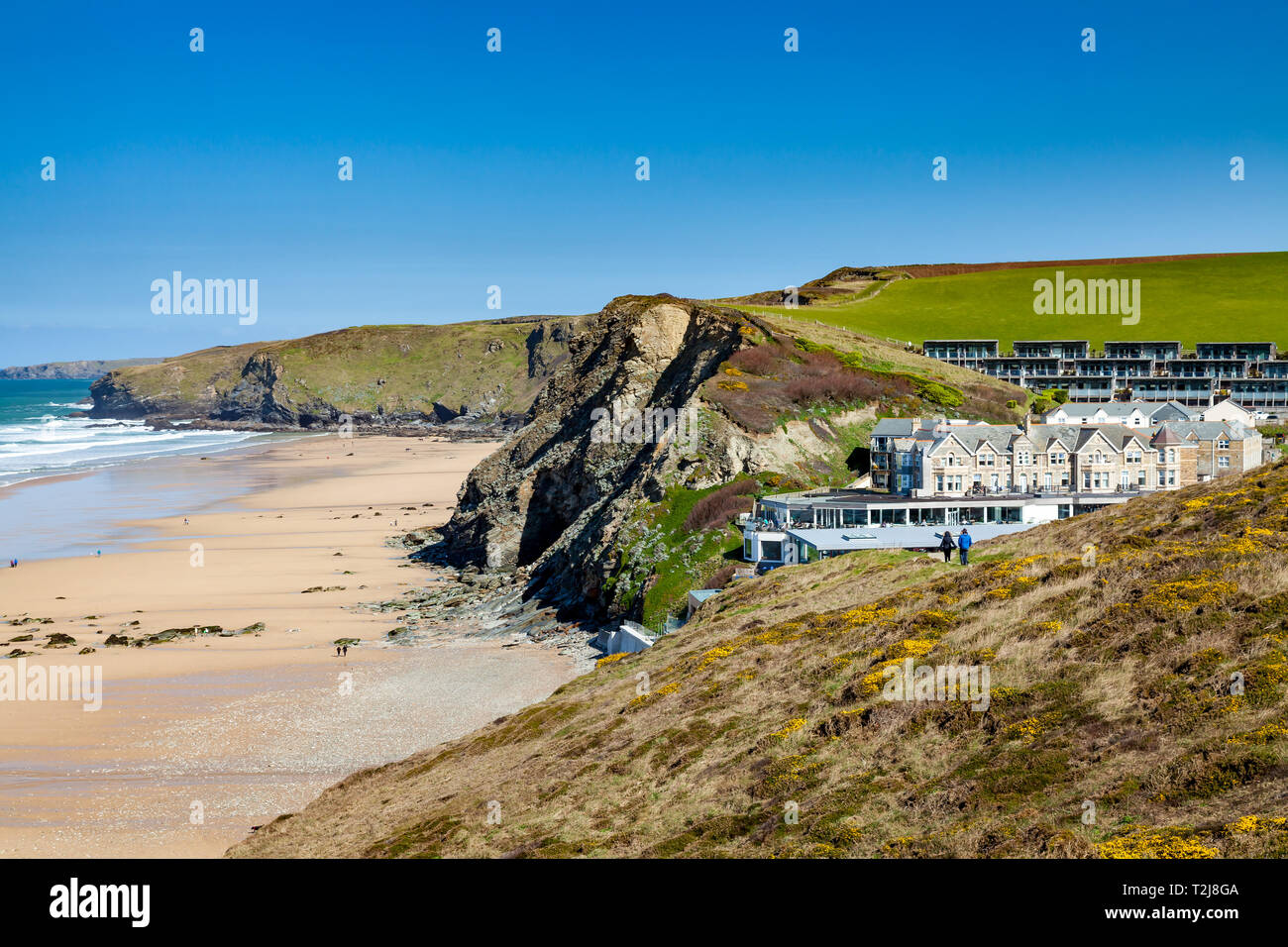 On the coast path overlooking the golden sandy beach at Watergate Bay ...