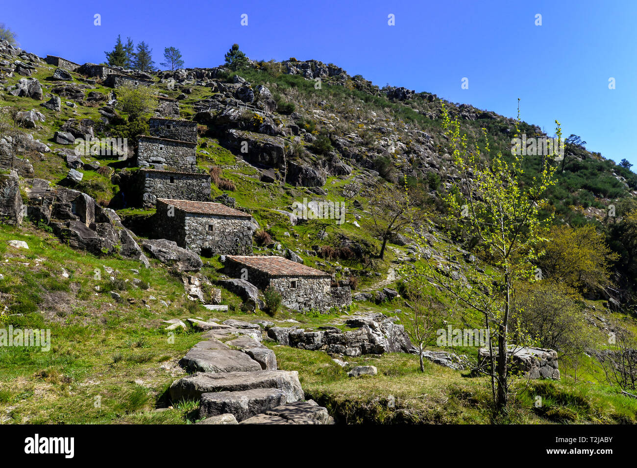 Water mills scattered through the hills in northwestern Spain on the ...