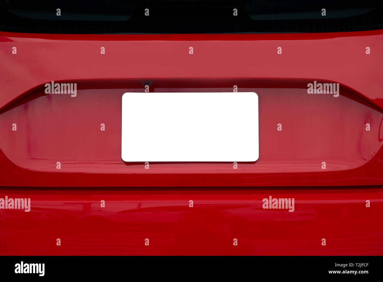 Horizontal shot of a blank white license plate on the back of red car ...