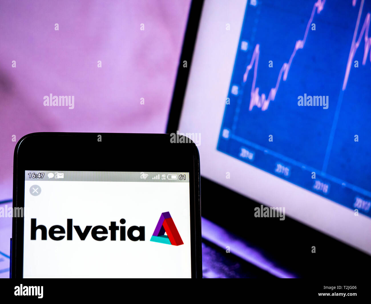 In this photo illustration a Helvetia Group logo seen displayed on a ...