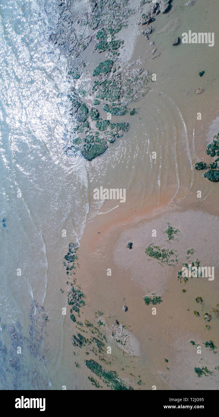 Gentle surf laps a sandy beach, seen from above, Sussex, UK Stock Photo ...