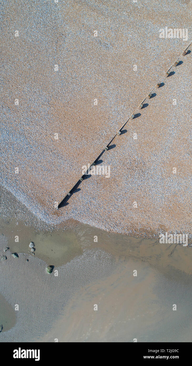Gentle surf laps a sandy beach, seen from above, Sussex, UK Stock Photo ...
