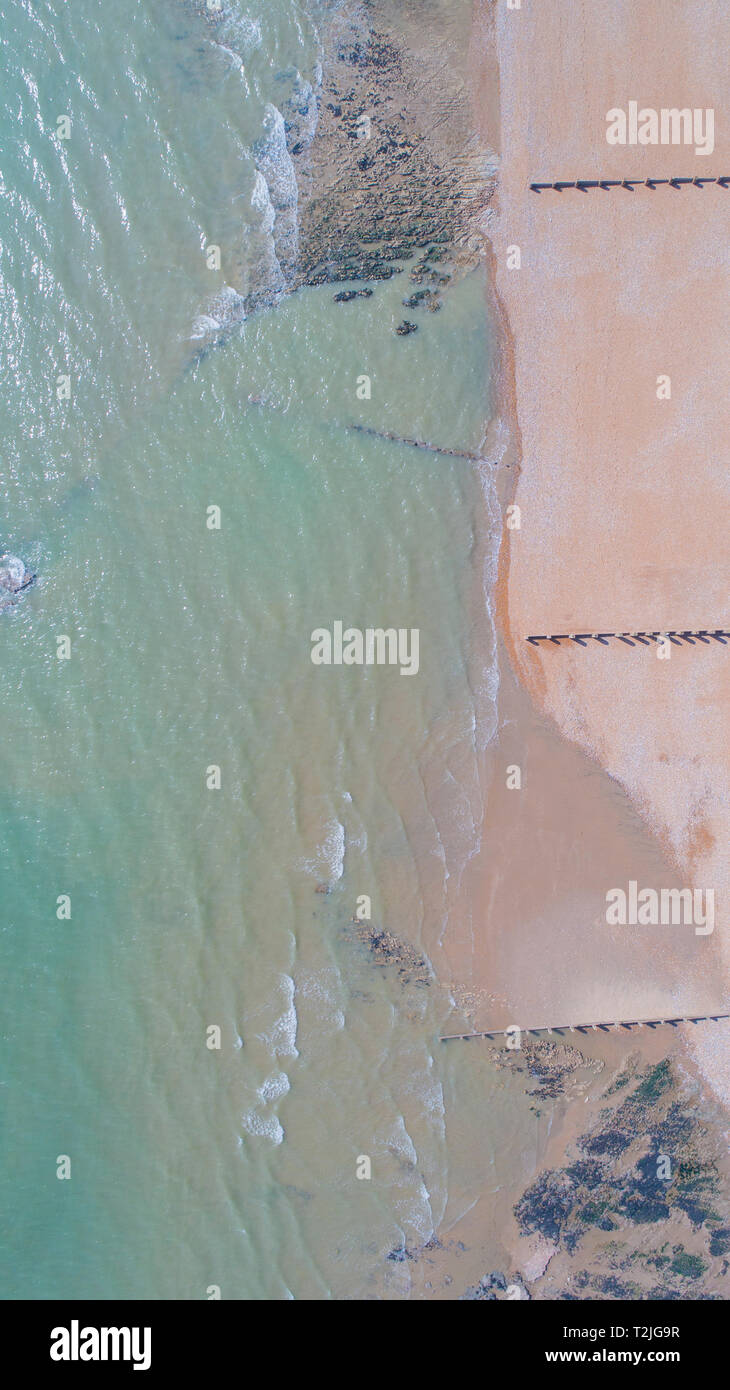 Gentle surf laps a sandy beach, seen from above, Sussex, UK Stock Photo ...