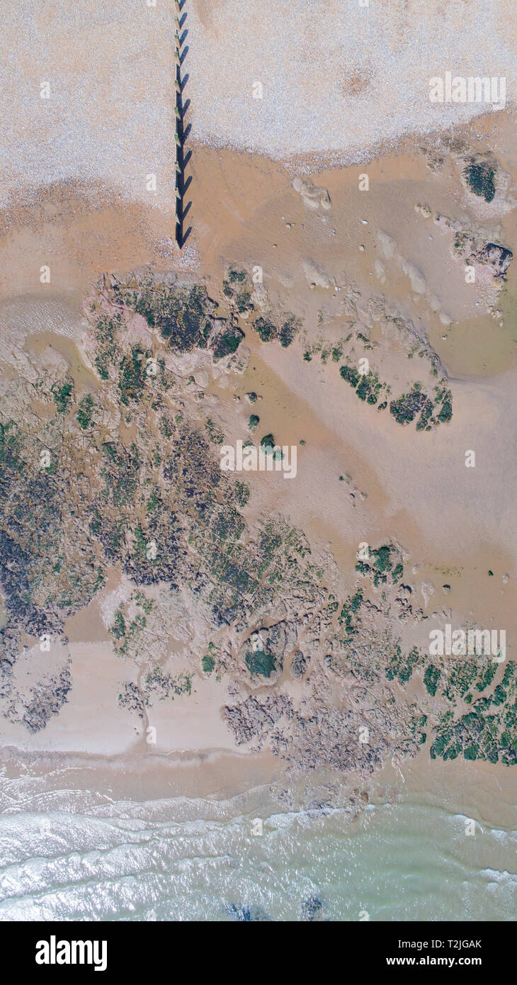 Gentle surf laps a sandy beach, seen from above, Sussex, UK Stock Photo ...