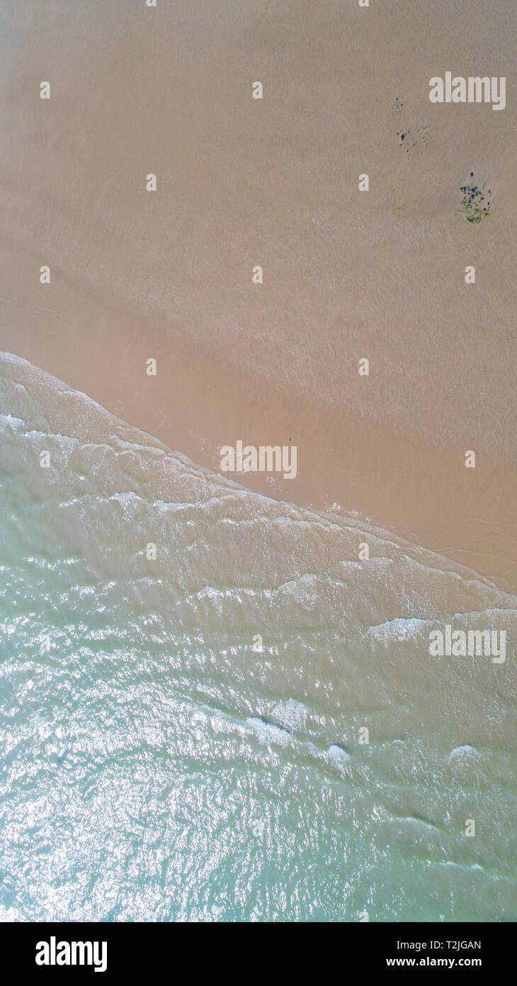 Gentle surf laps a sandy beach, seen from above, Sussex, UK Stock Photo ...