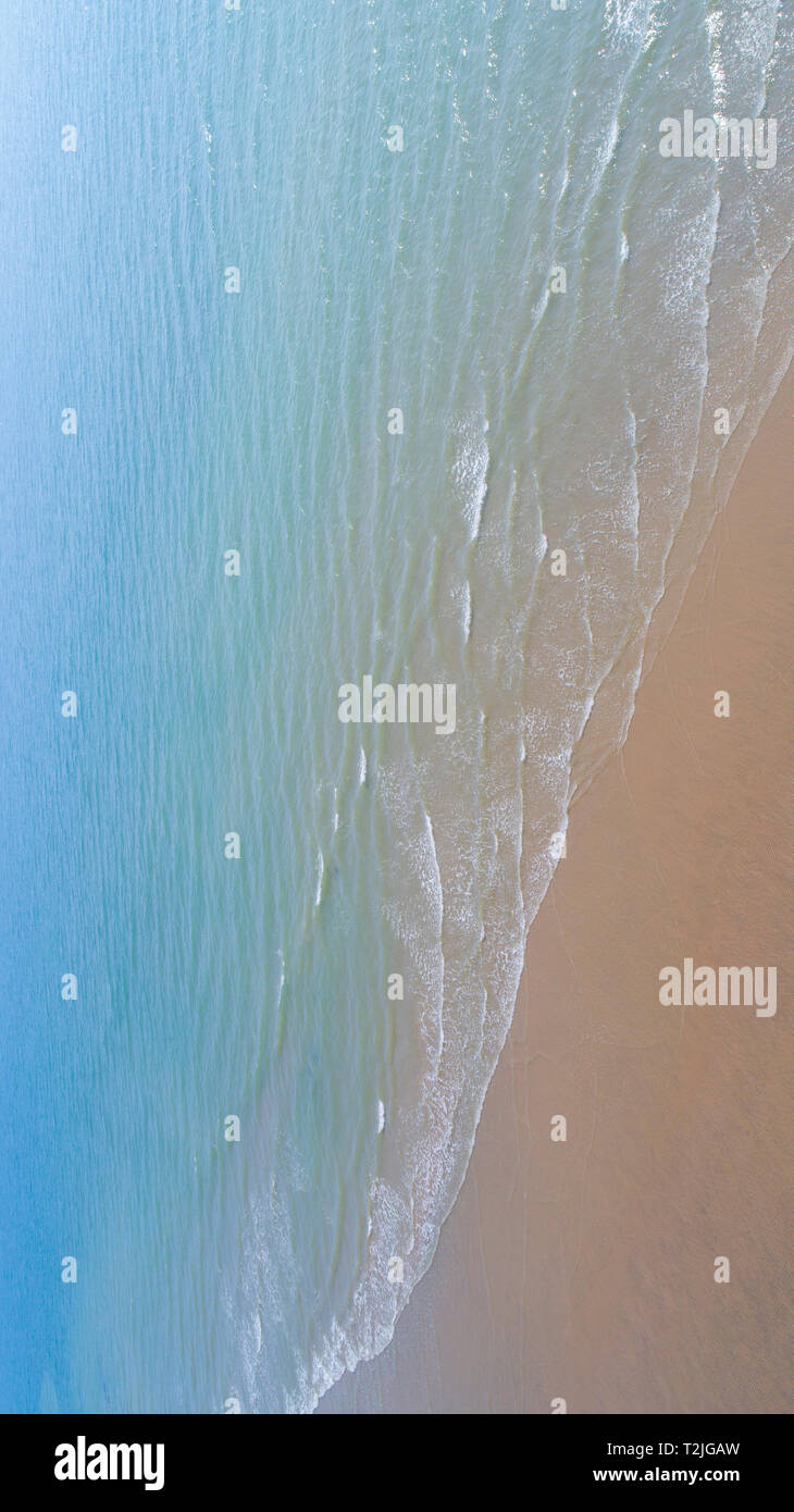 Gentle surf laps a sandy beach, seen from above, Sussex, UK Stock Photo ...