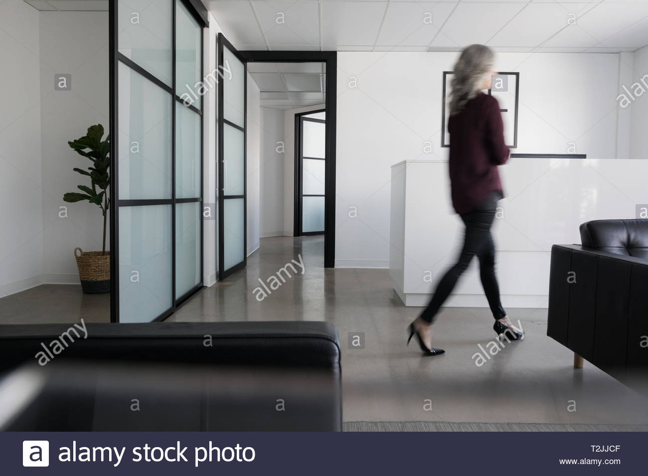 Woman walking office one person hi-res stock photography and images - Alamy