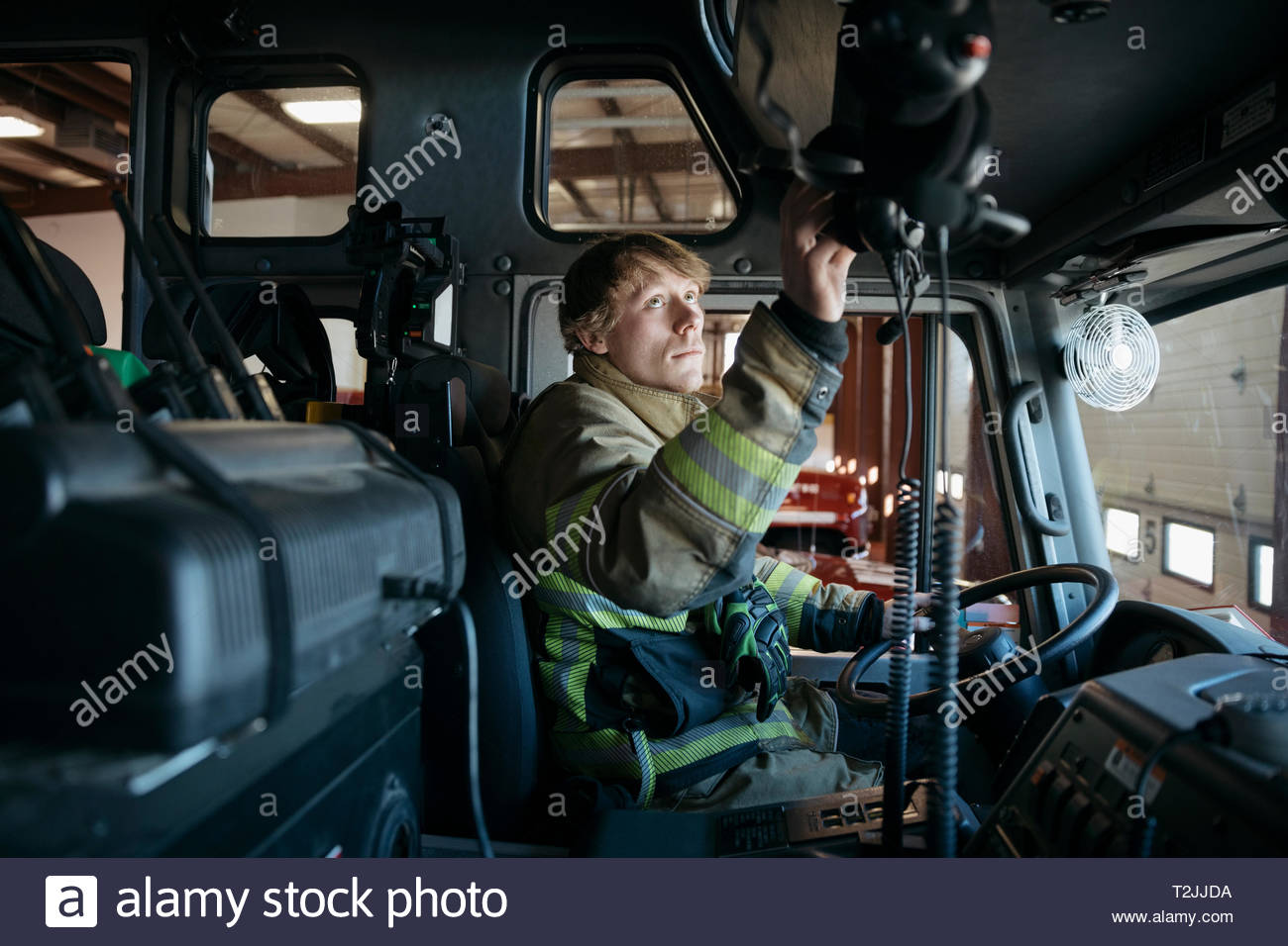 Firefighter driving fire engine hi-res stock photography and images - Alamy
