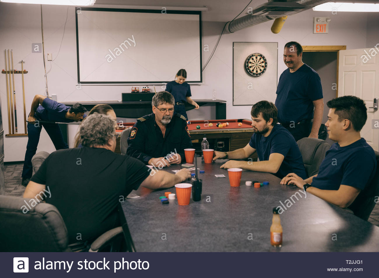 People sitting poker table playing hi-res stock photography and images ...