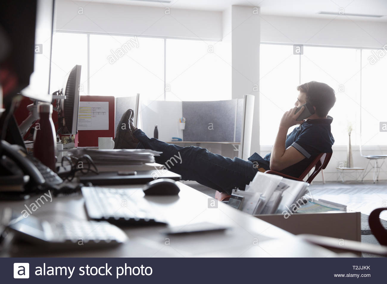 Feet desk phone hi-res stock photography and images - Alamy
