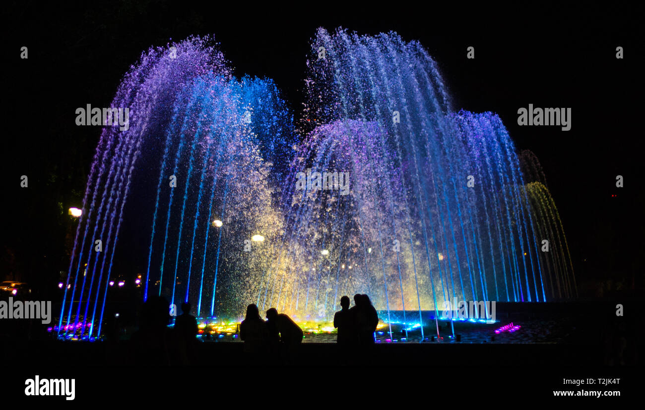 Brightly and colorfully lit fountain Stock Photo - Alamy