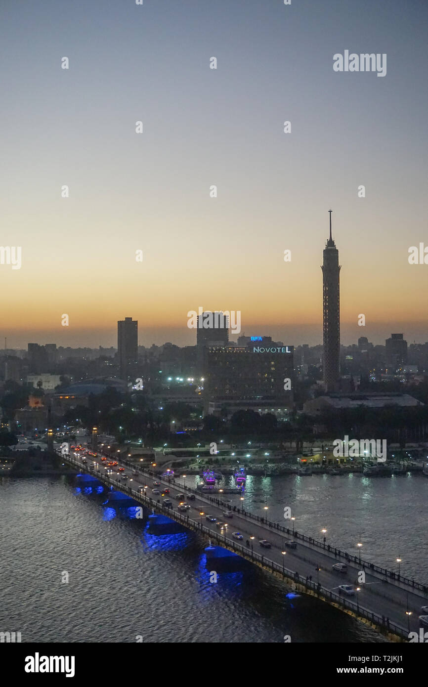Cairo, Egypt: Cairo Tower and the Qasr el Nile Bridge at sunset. On ...