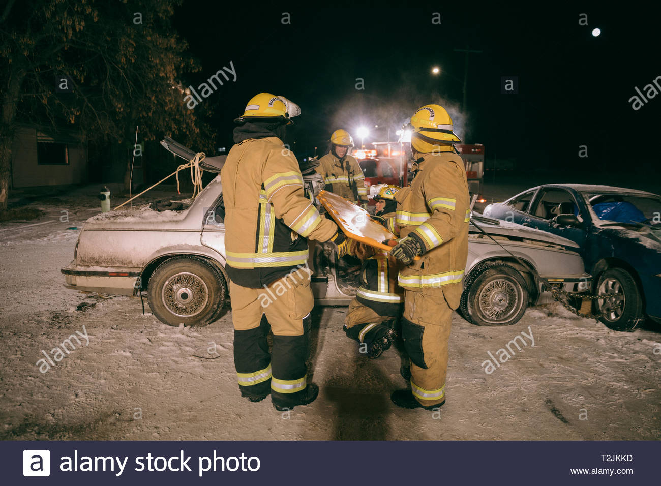 Firefighters at accident scene hi-res stock photography and images - Alamy