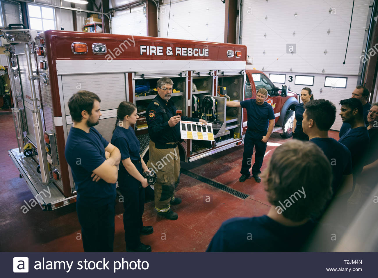 Firefighters meeting in fire station Stock Photo - Alamy