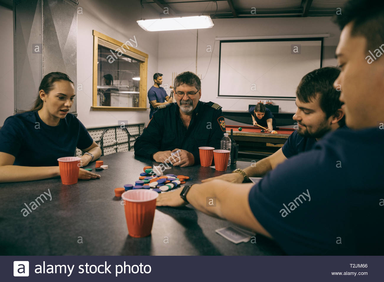 People sitting poker table playing hi-res stock photography and images ...