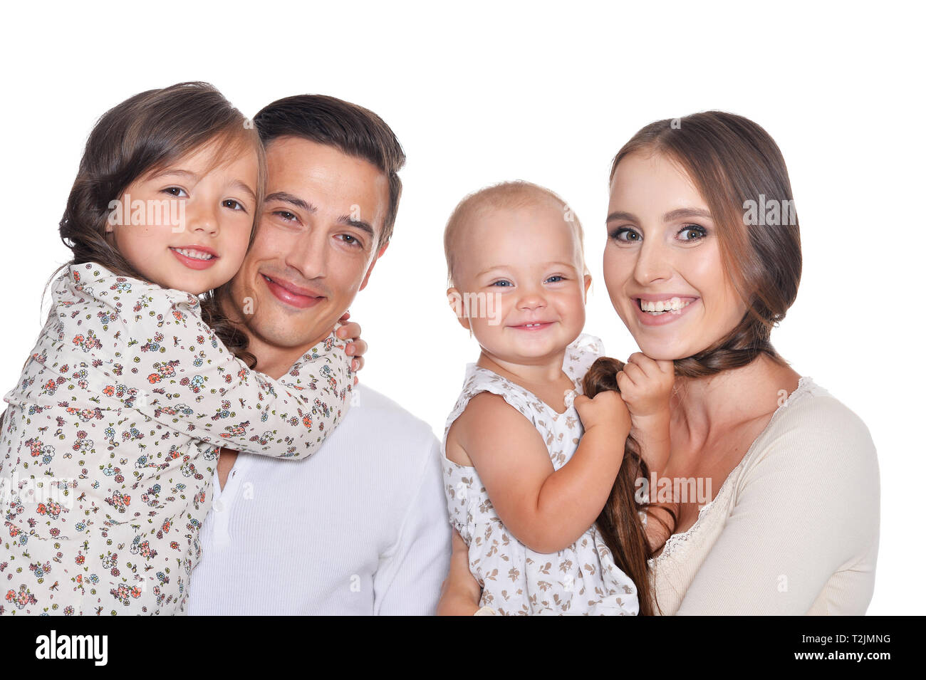 Happy family of four posing isolated on white background Stock Photo ...
