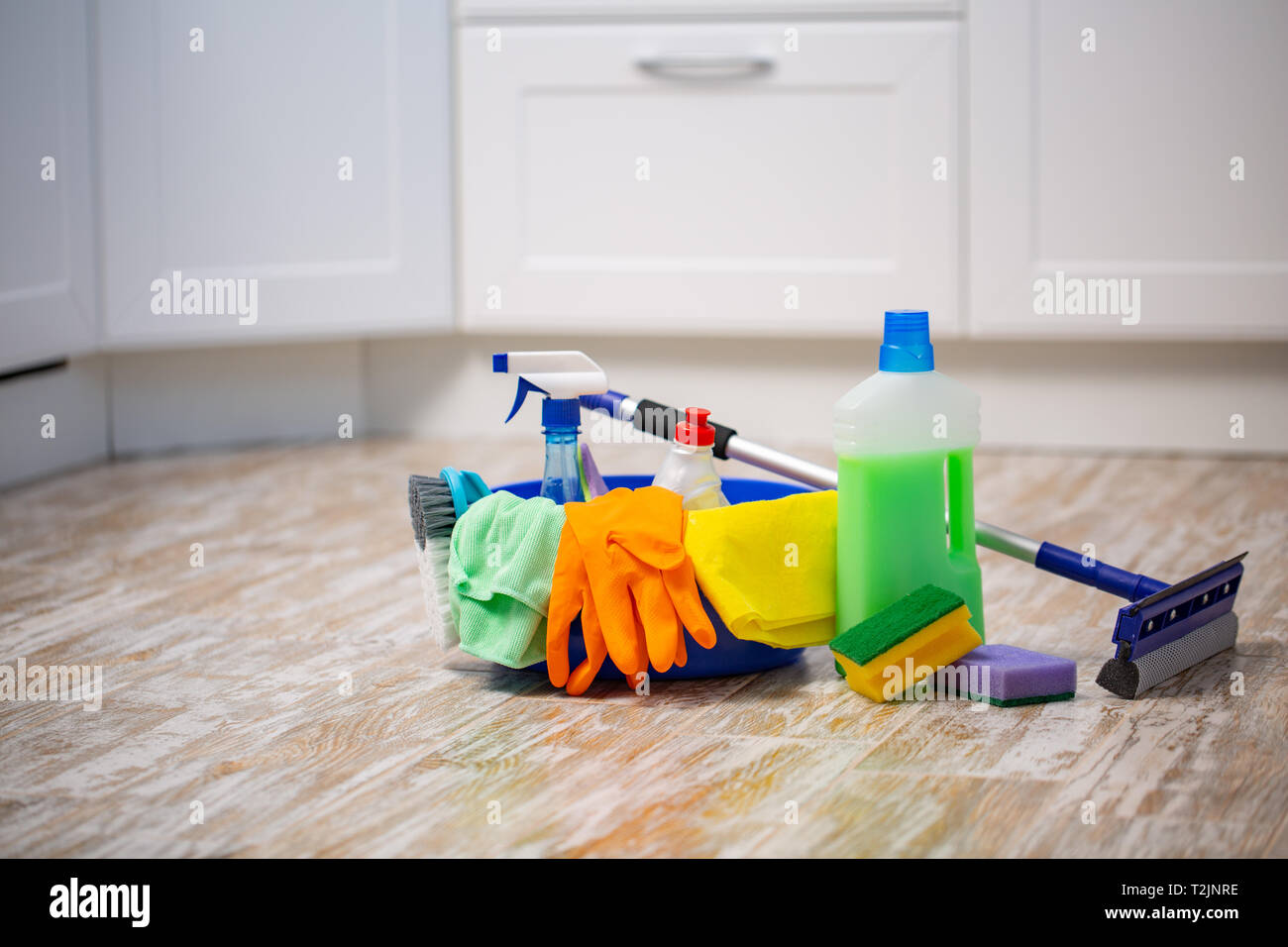 Cleaning concept with supplies at kitchen background. spring cleaning ...