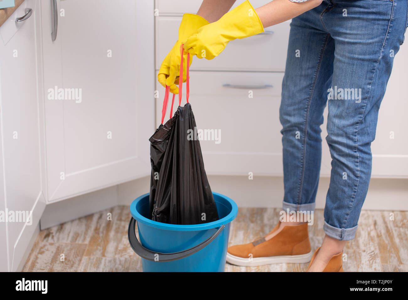 hand holding a trash garbage bag at home to take it away. After ...