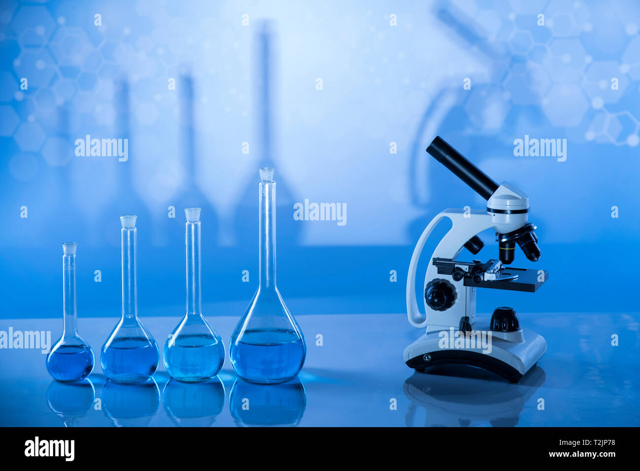 Laboratory beakers,Science experiment, blue background Stock Photo - Alamy