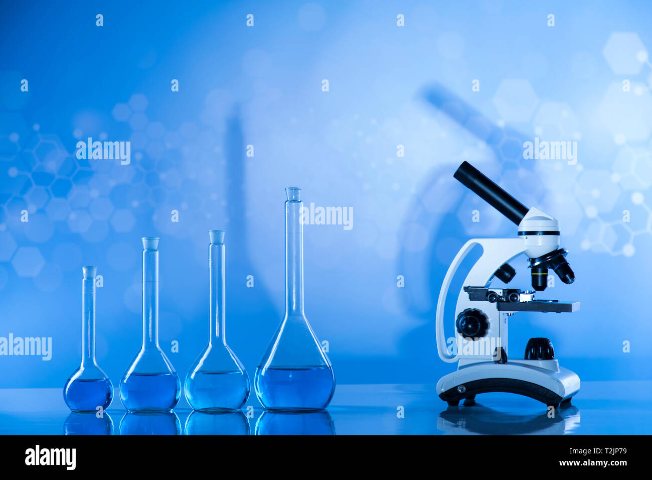 Laboratory beakers,Science experiment, blue background Stock Photo - Alamy