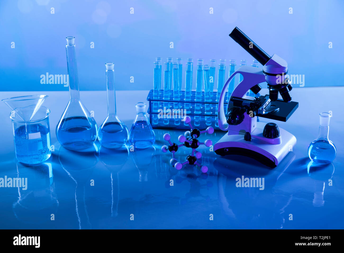 Laboratory beakers,Science experiment, blue background Stock Photo - Alamy