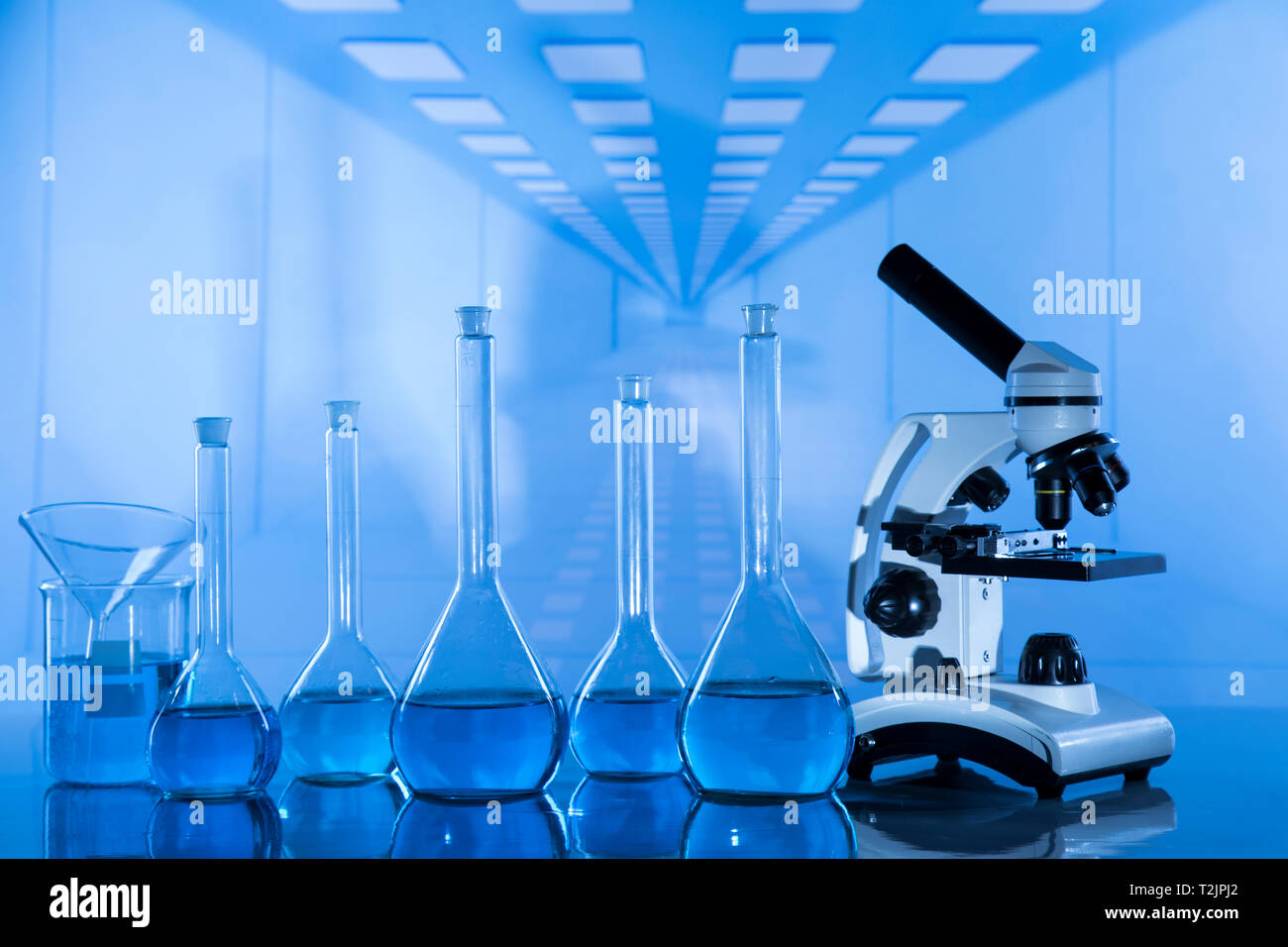 Laboratory beakers,Science experiment, blue background Stock Photo - Alamy