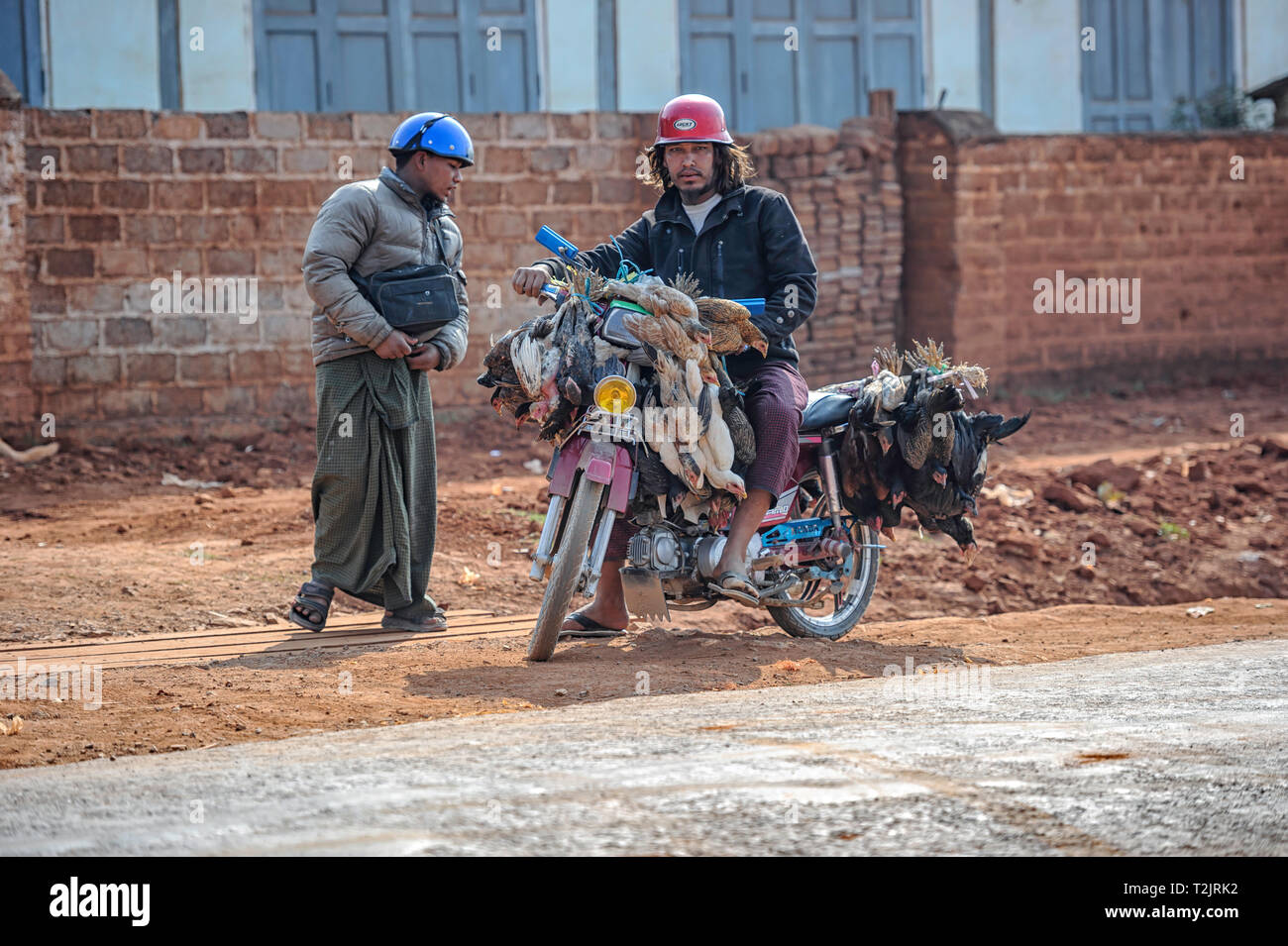 Man carrying motorcycle helmet hi-res stock photography and images - Alamy
